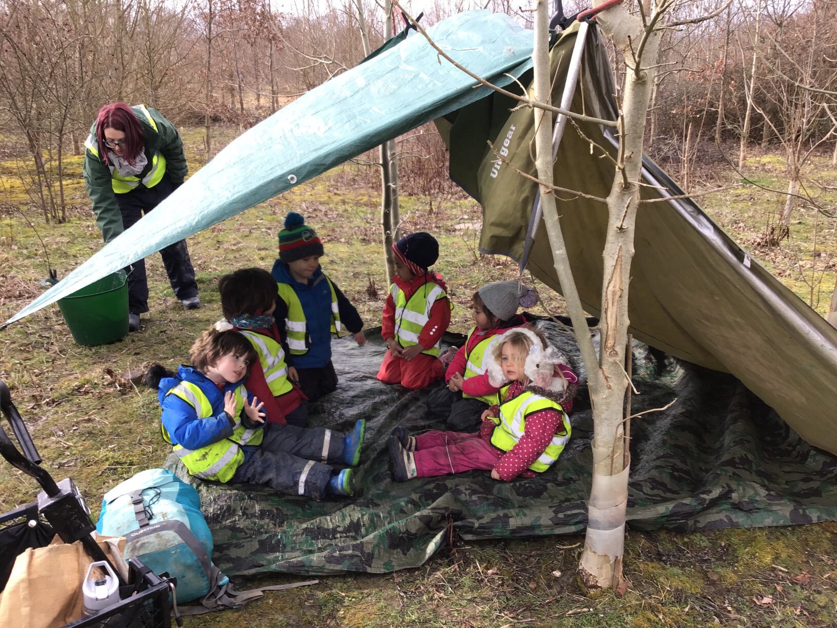 Kindergarten build dens in Forest School - Stephen Perse Nurseries